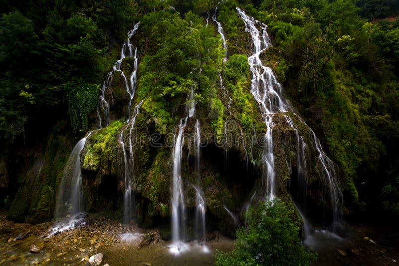 The Branches of the Waterfall Flowing from the Mountain and among the ...