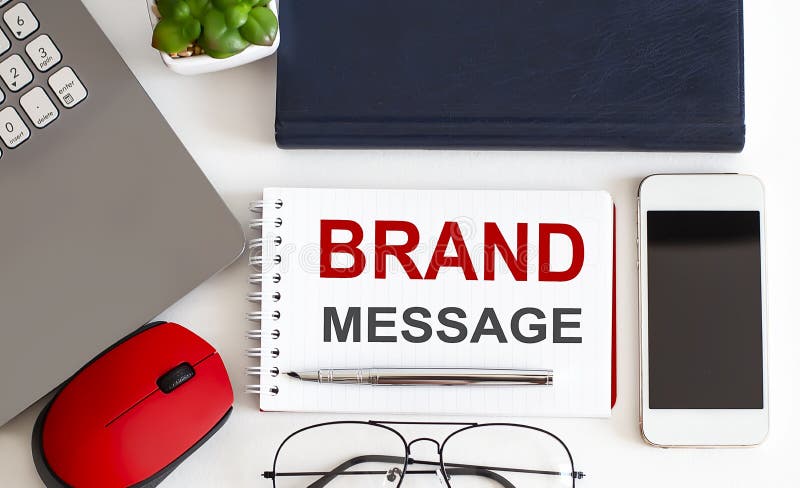 BRAND MESSAGE Text on Notepad,pen, Office Tools on the White Background ...