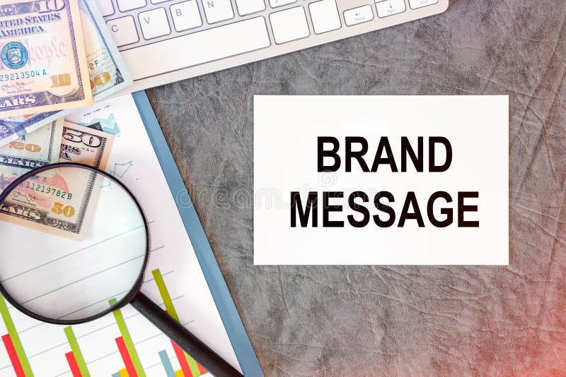 BRAND MESSAGE is Written in a Document on the Office Desk, Keyboard and ...
