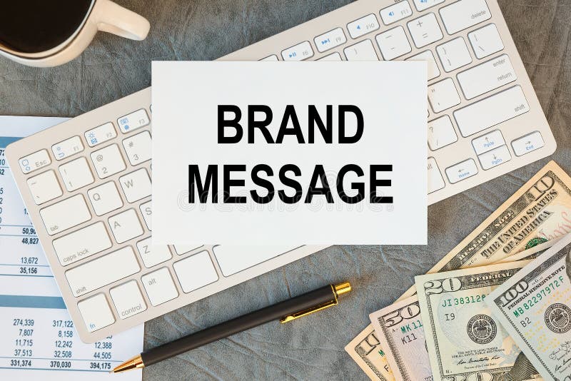 BRAND MESSAGE is Written in a Document on the Office Desk, Keyboard and ...