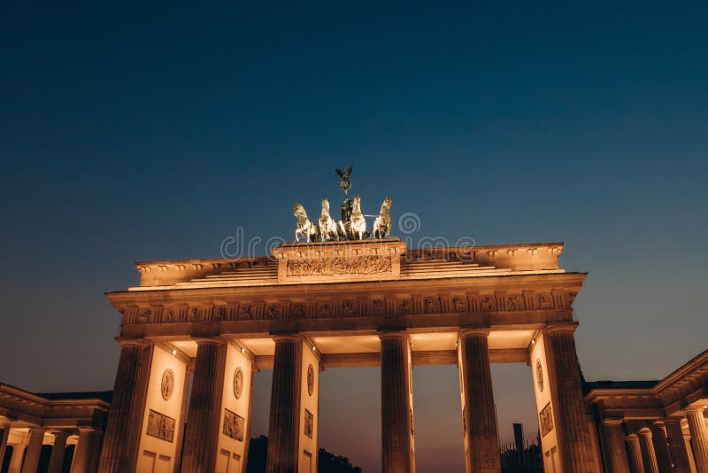 Brandenburg Gate Illuminated at Sunset in Berlin, Germany Editorial ...