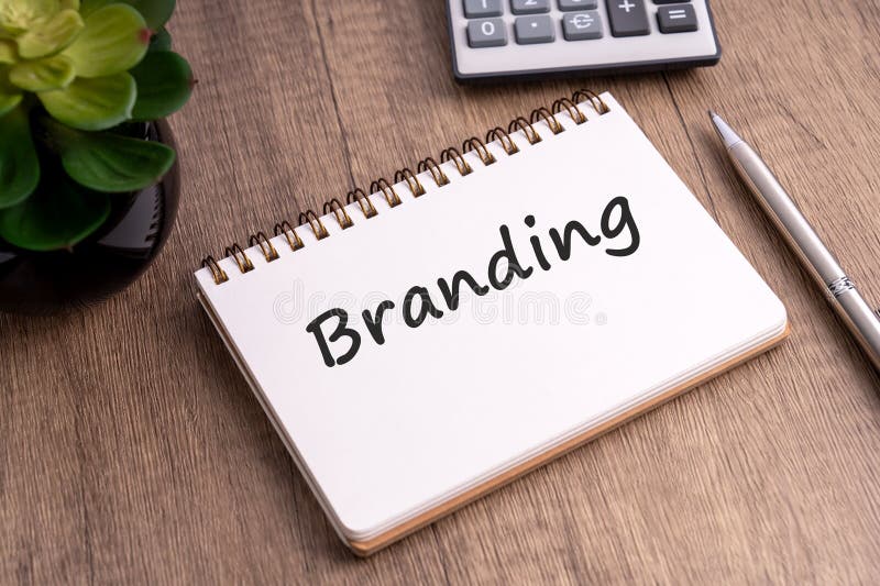 Branding Text in Note Pad and Pen, Calculator, Plane on the Table Stock ...