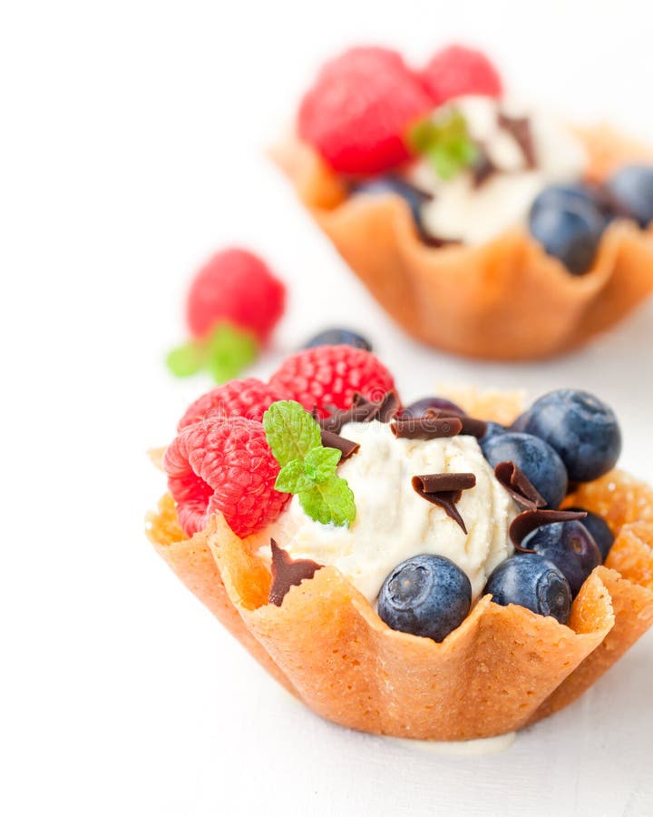 Brandy Snap Baskets with Ice Cream and Berries Isolated on Whit Stock ...