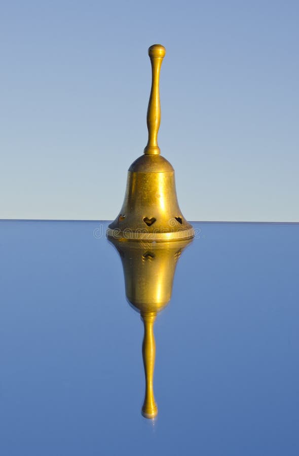 Brass Bell on Mirror and Reflection Stock Photo - Image of metal ...