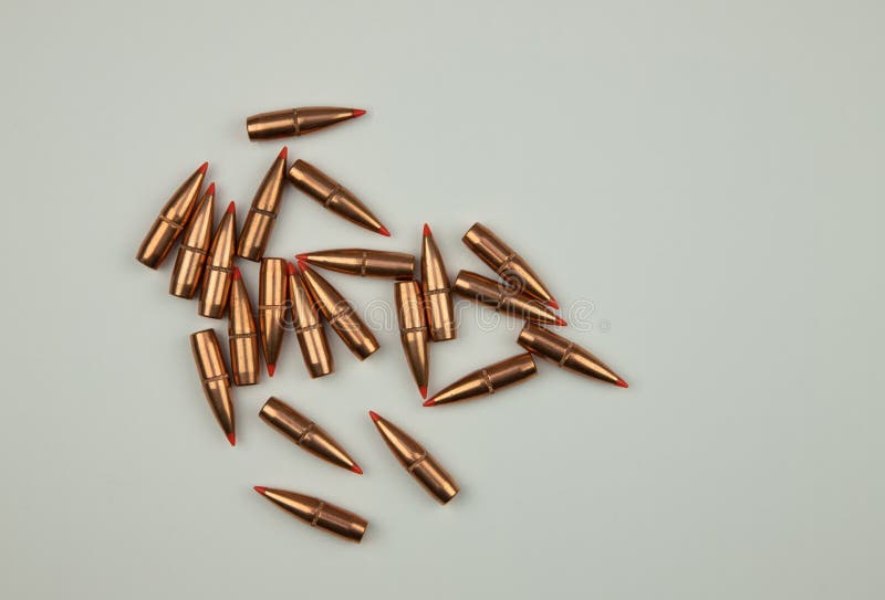 Brass Bullets Lie on a White Background, Plastic Tips Stock Image ...
