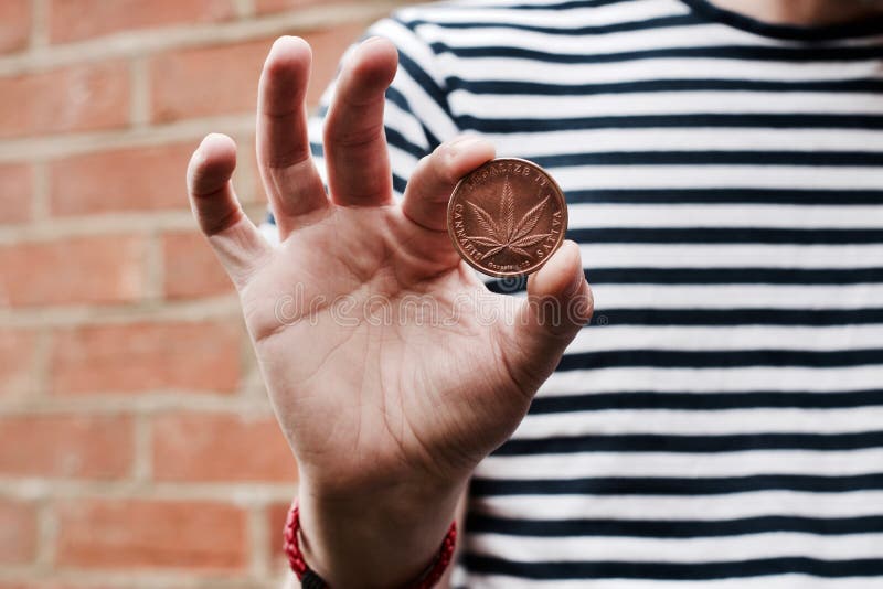 Brass cannabis coin stock photo. Image of plant, cash - 97419172