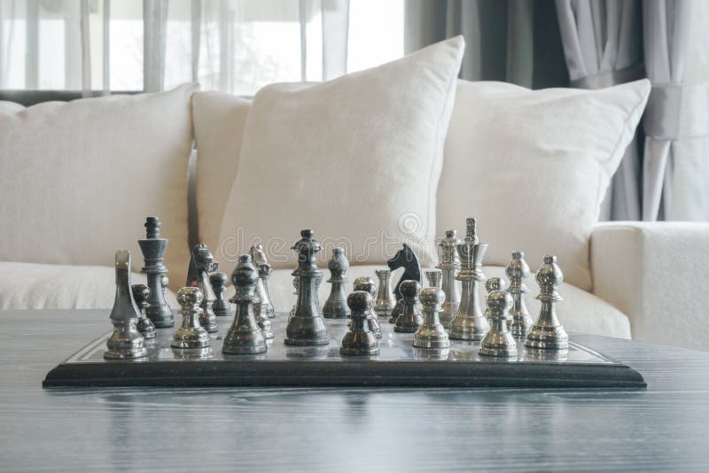 Brass Chess on Table with White Sofa Set in Living Room Stock Image ...