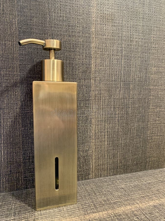 Brass dispenser stock photo. Image of shelf, dispenser - 331595158
