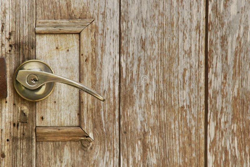 Brass Door Lever Lock Handle on Rustic Old Wooden Door Stock Image ...