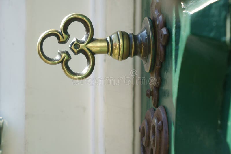 Brass Key in a Green Old Door Stock Photo - Image of home, concept ...