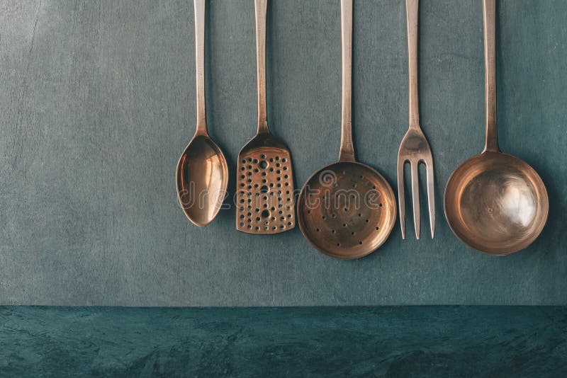 Brass Kitchen Utensil on the Wall Stock Image - Image of cooking, metal ...