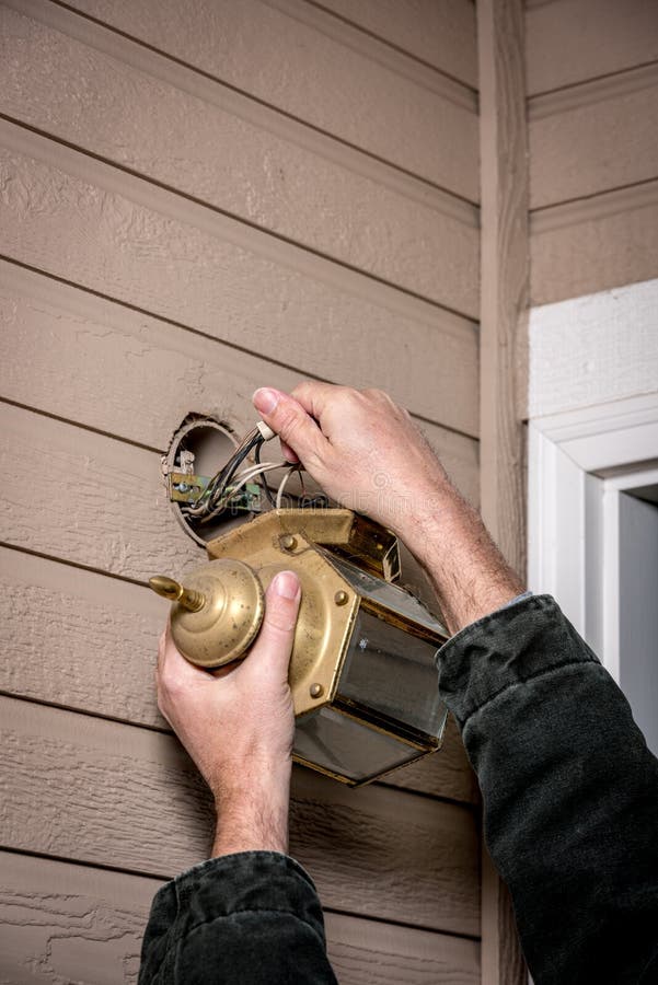Brass Light Fixture Removed from a Home Stock Photo - Image of work ...
