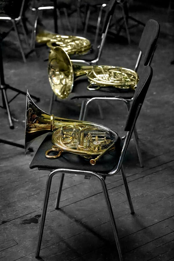 A Brass Musical Instrument Horn Lying on a Chair Stock Photo - Image of ...