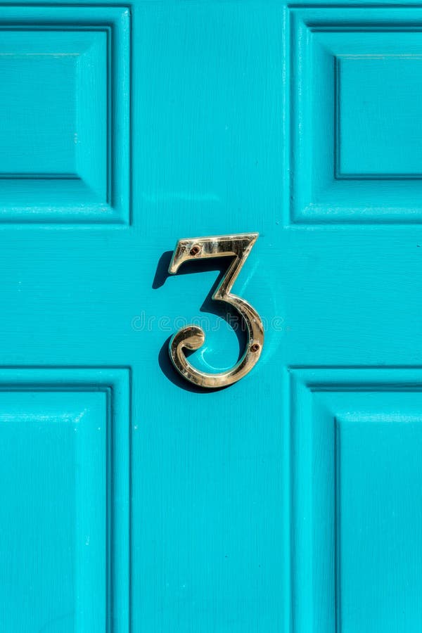 Brass Number Three on a Teal Door with Reflection and Shadow Stock ...