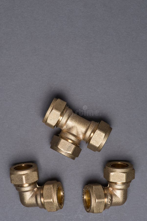 Brass Plumbing Compression Fittings on Grey Table Stock Photo - Image ...