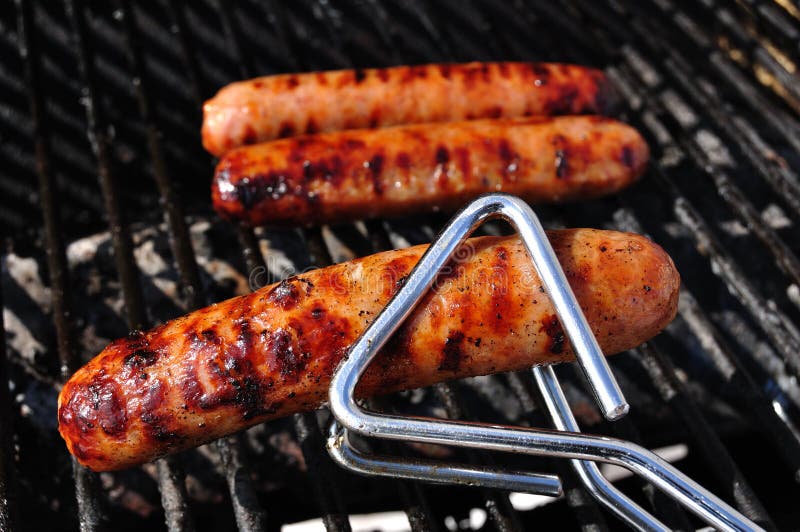 Bratwursts on the Grill stock photo. Image of burning - 44393090