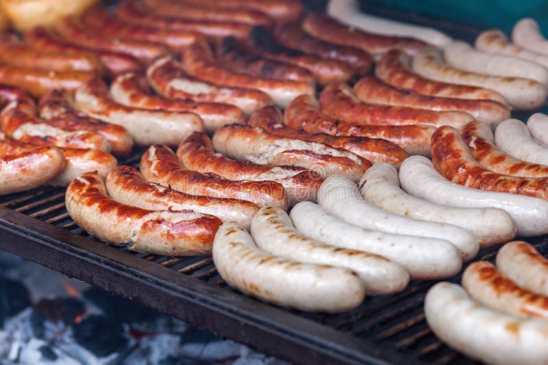 Bratwurst on a large grill stock photo. Image of brat - 71965580