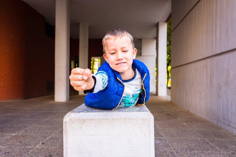 Brave Boy with Gesture of Impetuousness and Empowerment Playing in the ...