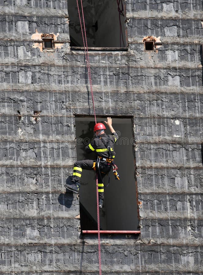 Climber of Firefighters Rappelling the Wall during the Fire Drill Stock ...