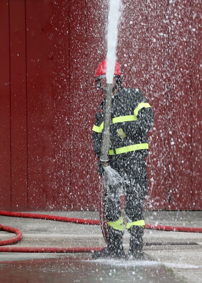 Brave Firefighter with Hydrant Stock Image - Image of firemen, action ...