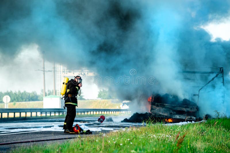 Brave Firefighter Puts Out the Fire of Burning Car Stock Image - Image ...