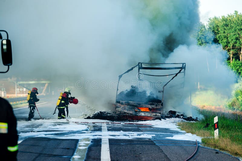 Brave Firefighter Puts Out the Fire of Burning Car Stock Image - Image ...