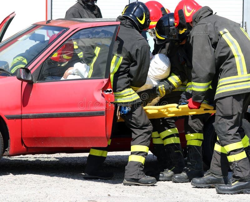 Firefighters Pull in Wounded by Car Plates after Road Crash Stock Image ...