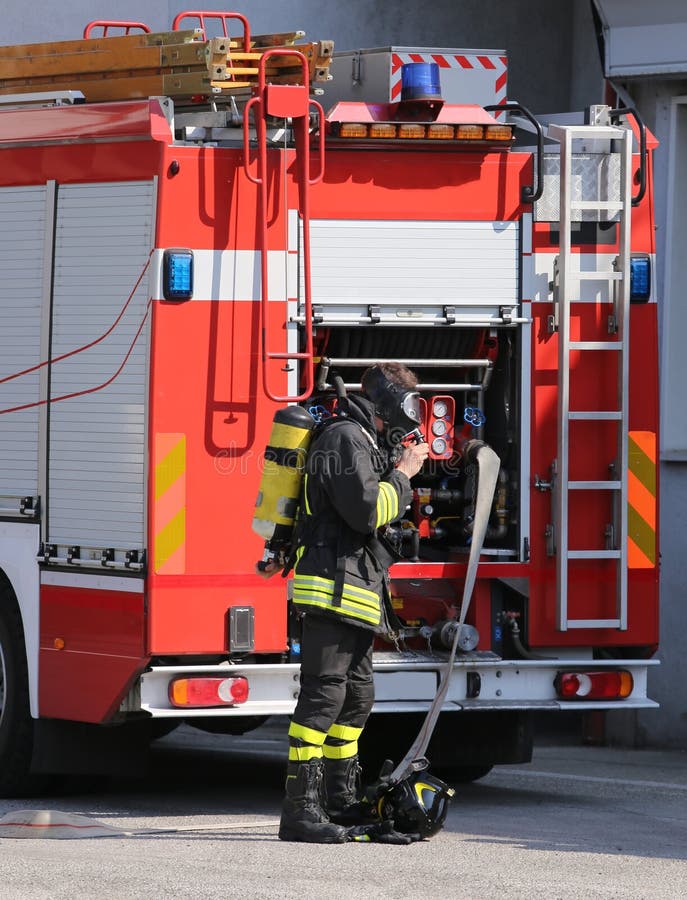 Brave Firefighters with Fire Engine Truck during an Exercise Stock ...