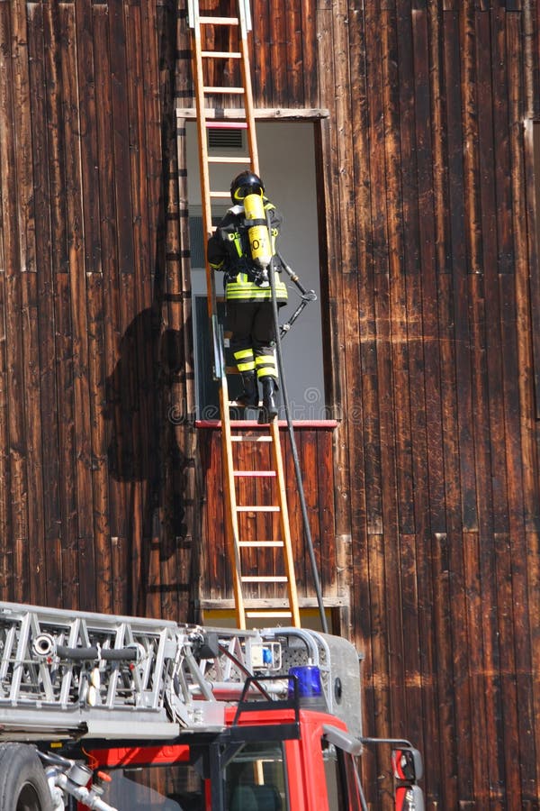 Brave Firefighters with Oxygen Tank Fire during an Exercise Held Stock ...