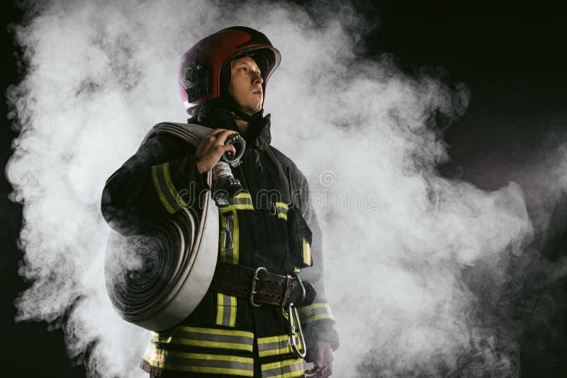 Brave fireman in uniform stock photo. Image of emotions - 167402794