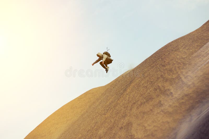 Brave Man with Backpack Running and Jumping on a Dune Stock Image ...