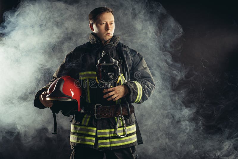 Brave fireman in uniform stock photo. Image of emotions - 167402794
