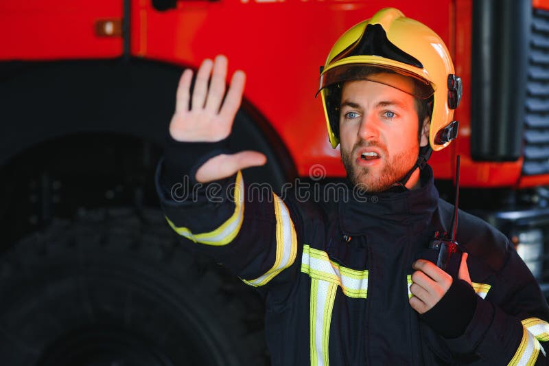 Brave Young Fireman Wearing Protective Uniform. Stock Photo - Image of ...