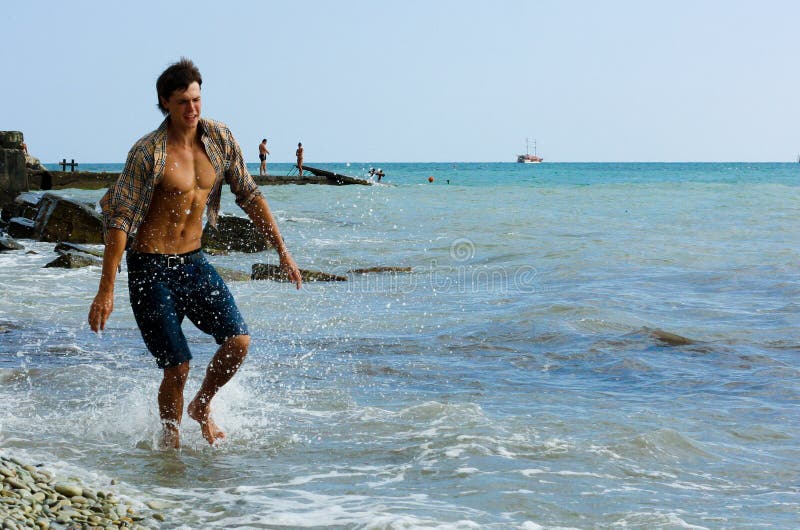 Brawny lad stock photo. Image of rocks, horizontal, shirt - 22241754