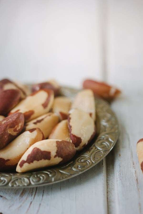 Brazil Nuts Metal Plate Over White Wooden Table Stock Photos - Free ...