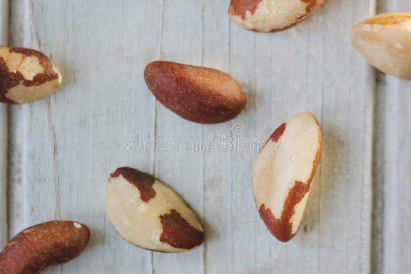 Brazil Nuts Over the White Wooden Table. Stock Image - Image of heap ...