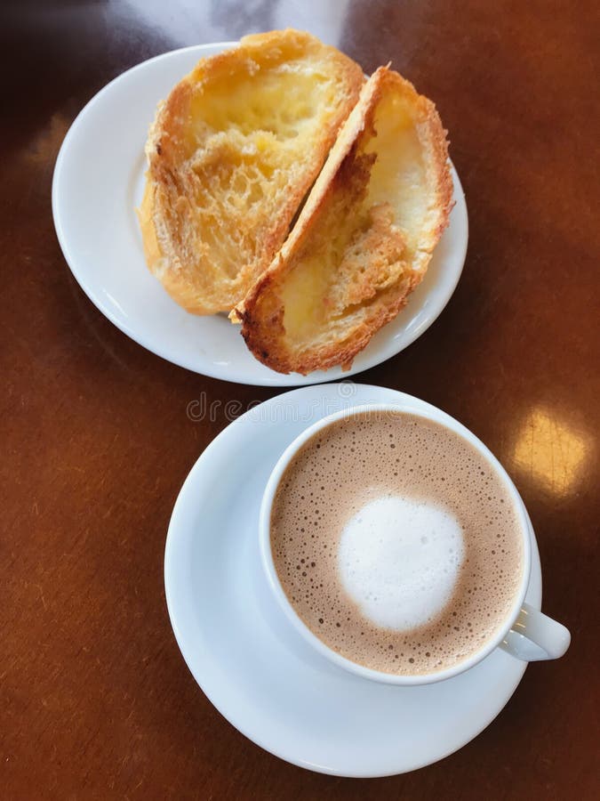 Brazilian Breakfast. Bread Toast with Butter and Coffee on a Table ...