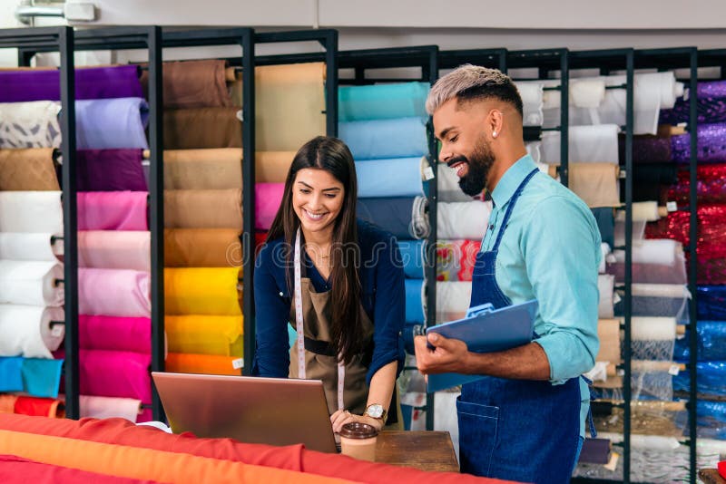 Brazilian Colleagues Checking on Laptop Sales Report Inside Store Stock ...