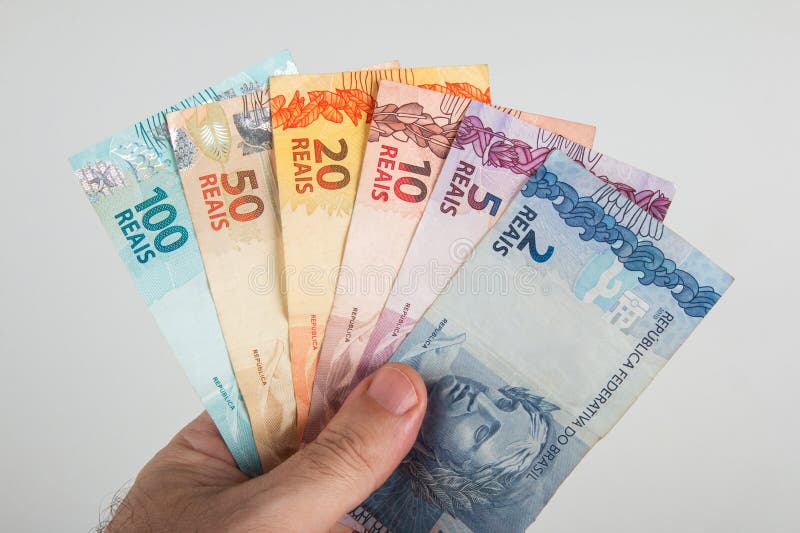 Brazilian Money. Brazilian Real Notes in Hand Stock Photo - Image of ...
