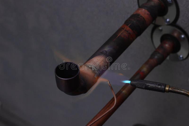 Brazing copper pipes stock image. Image of wood, iron - 227832659