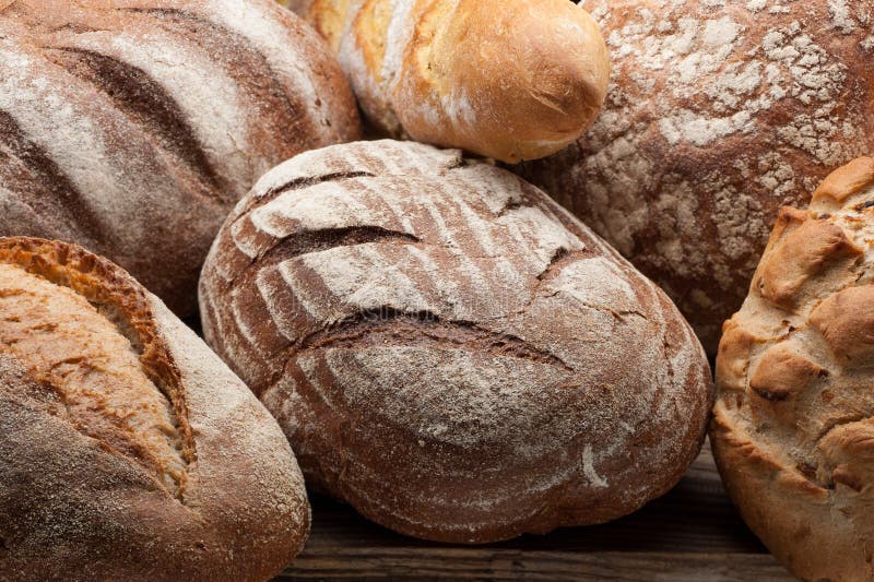 Bread Arranged on Wooden Table Stock Photo - Image of bakery, wheat ...