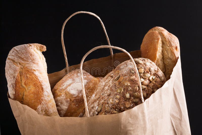 Paper Bag with Bread Assortment at Black Background Stock Image - Image ...