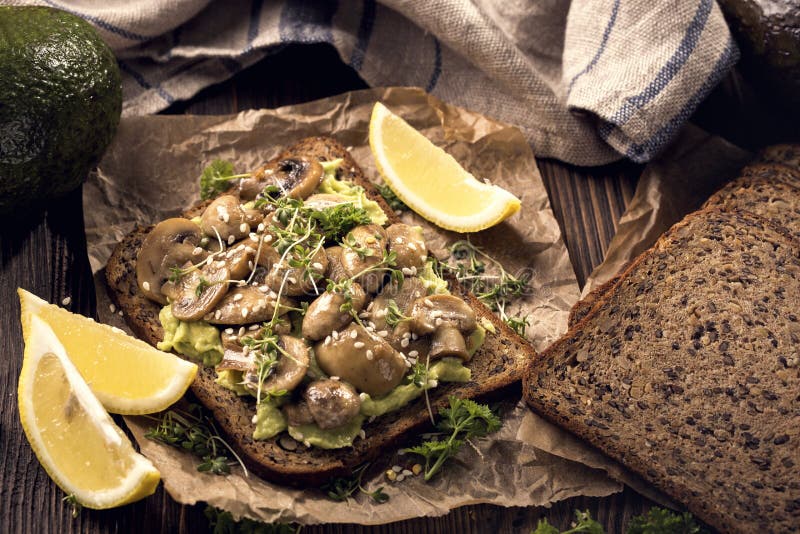 Bread with Avocado Spread and Champignons Stock Photo - Image of spread ...