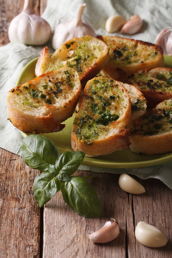 Bread with Basil and Garlic Closeup on Plate. Vertical Stock Photo ...