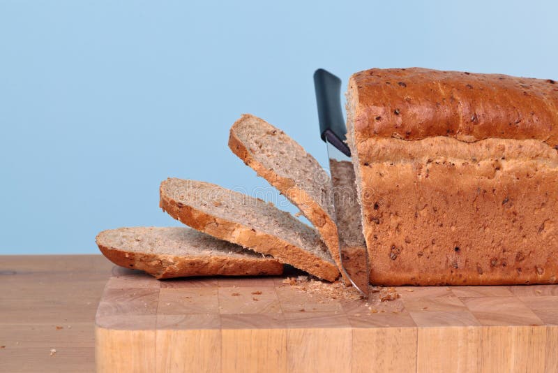 Bread being sliced stock image. Image of wholemeal, copy - 20535091