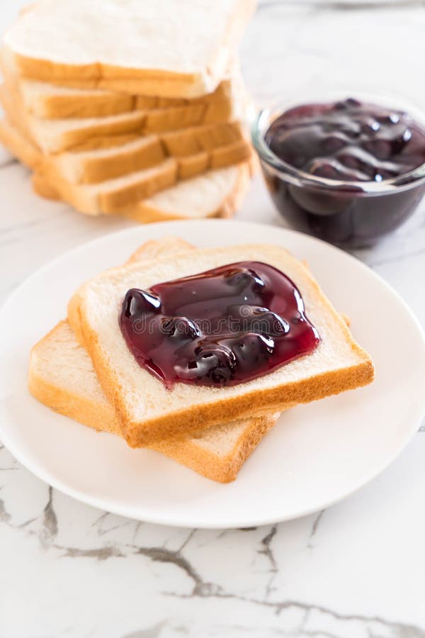 Bread with blueberry jam stock photo. Image of slice - 109722526