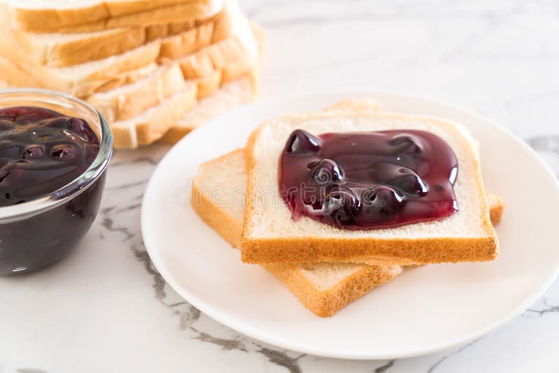 Bread with blueberry jam stock photo. Image of white - 114384938