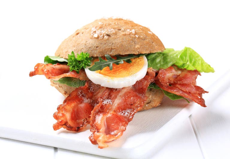 Bread Bun with Crispy Bacon Stock Photo - Image of food, breakfast ...