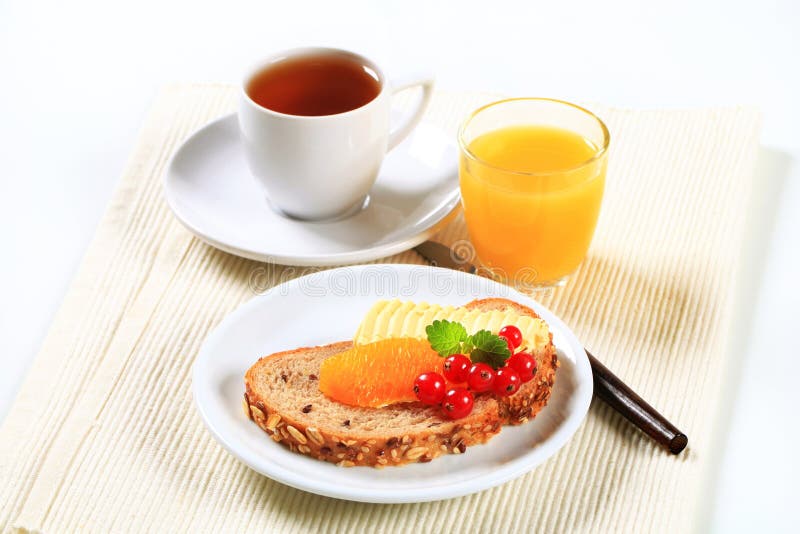 Bread with Butter, Cup of Tea and Orange Juice Stock Image - Image of ...