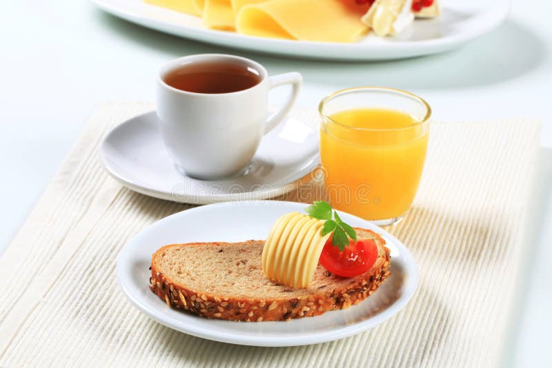 Bread with Butter, Cup of Tea and Orange Juice Stock Photo - Image of ...